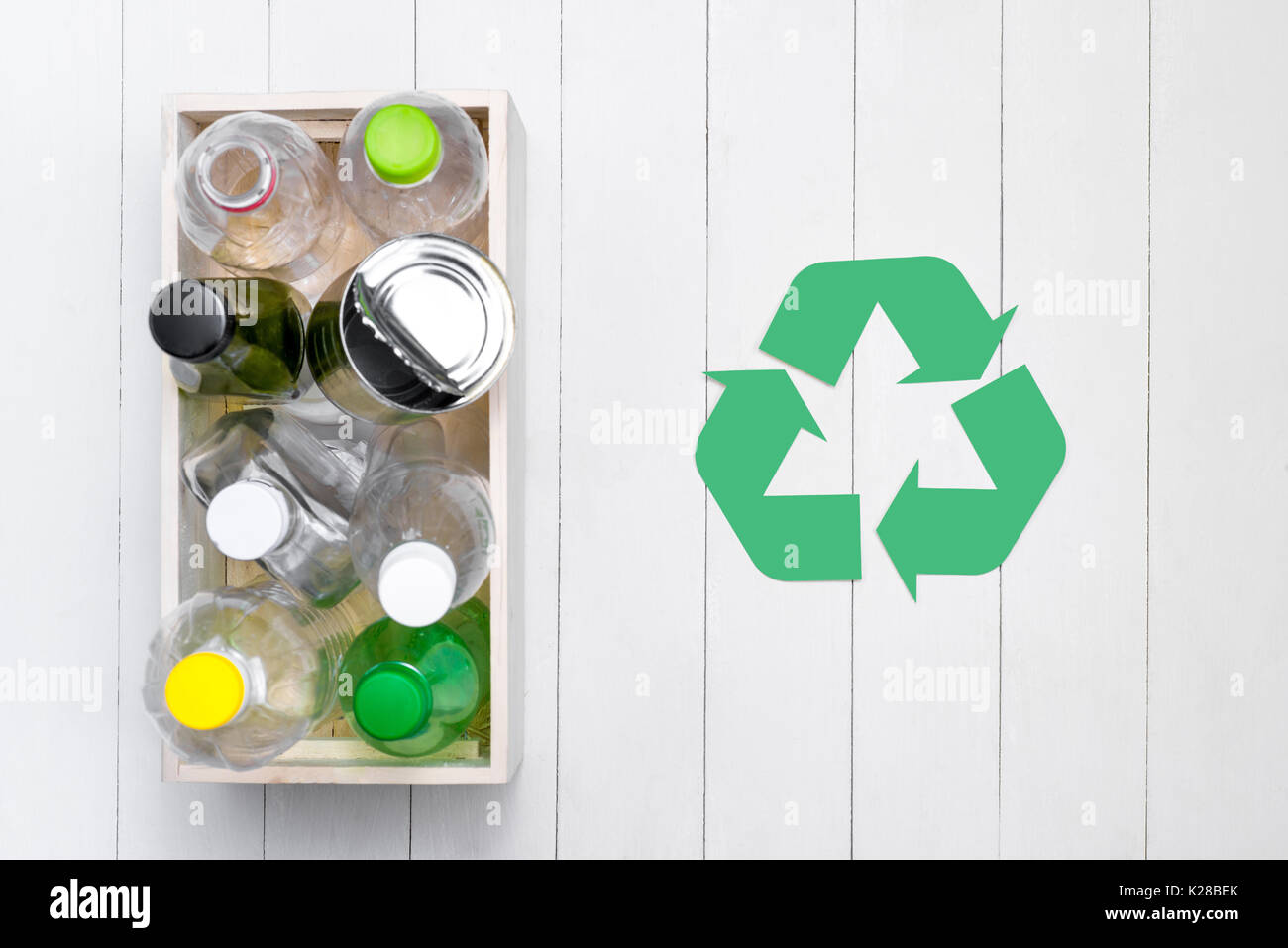 Eco concept. Waste recycling symbol with garbage on stone Stock Photo ...