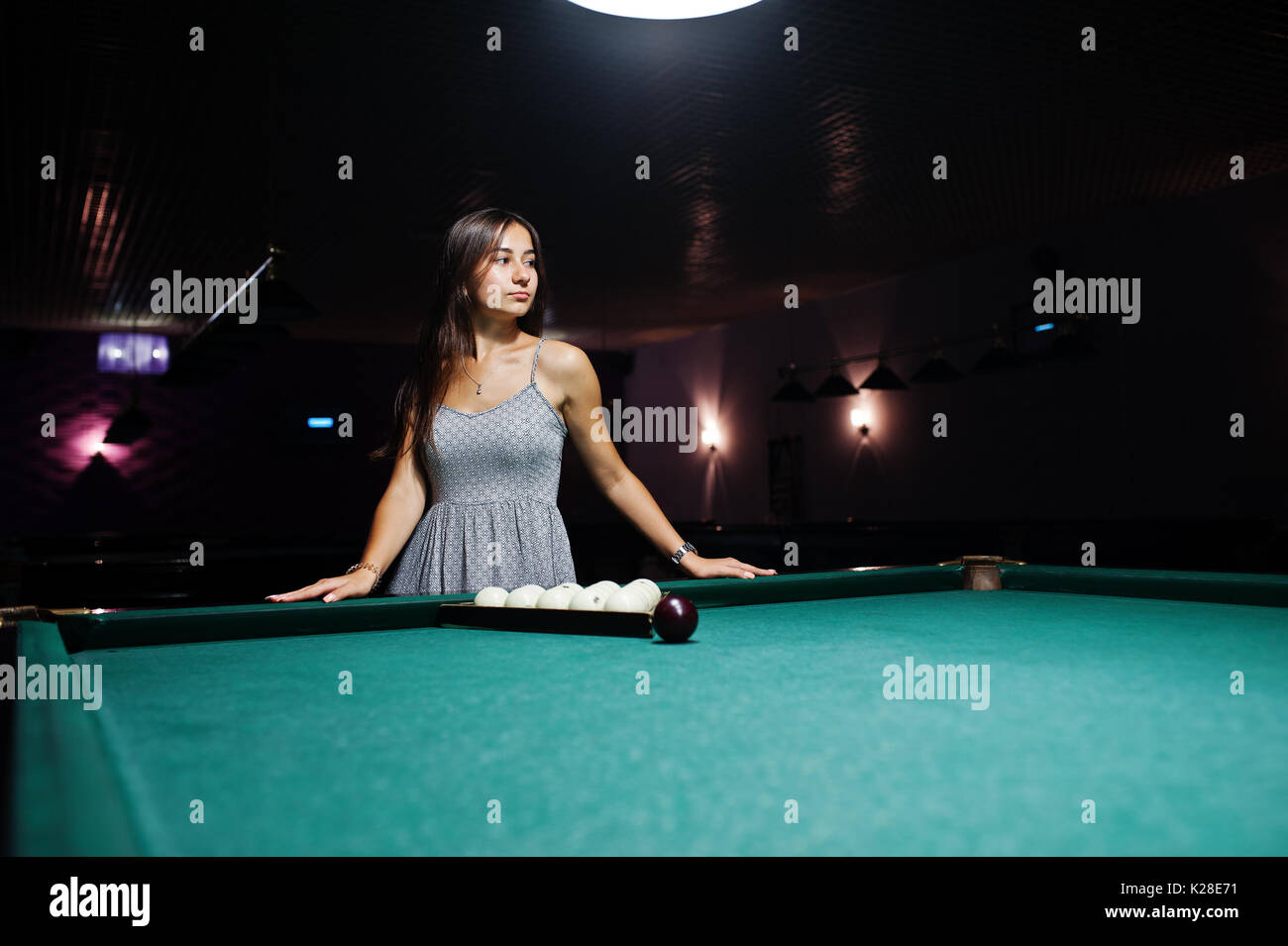 Beautiful brunette woman playing billiards hi-res stock photography and ...