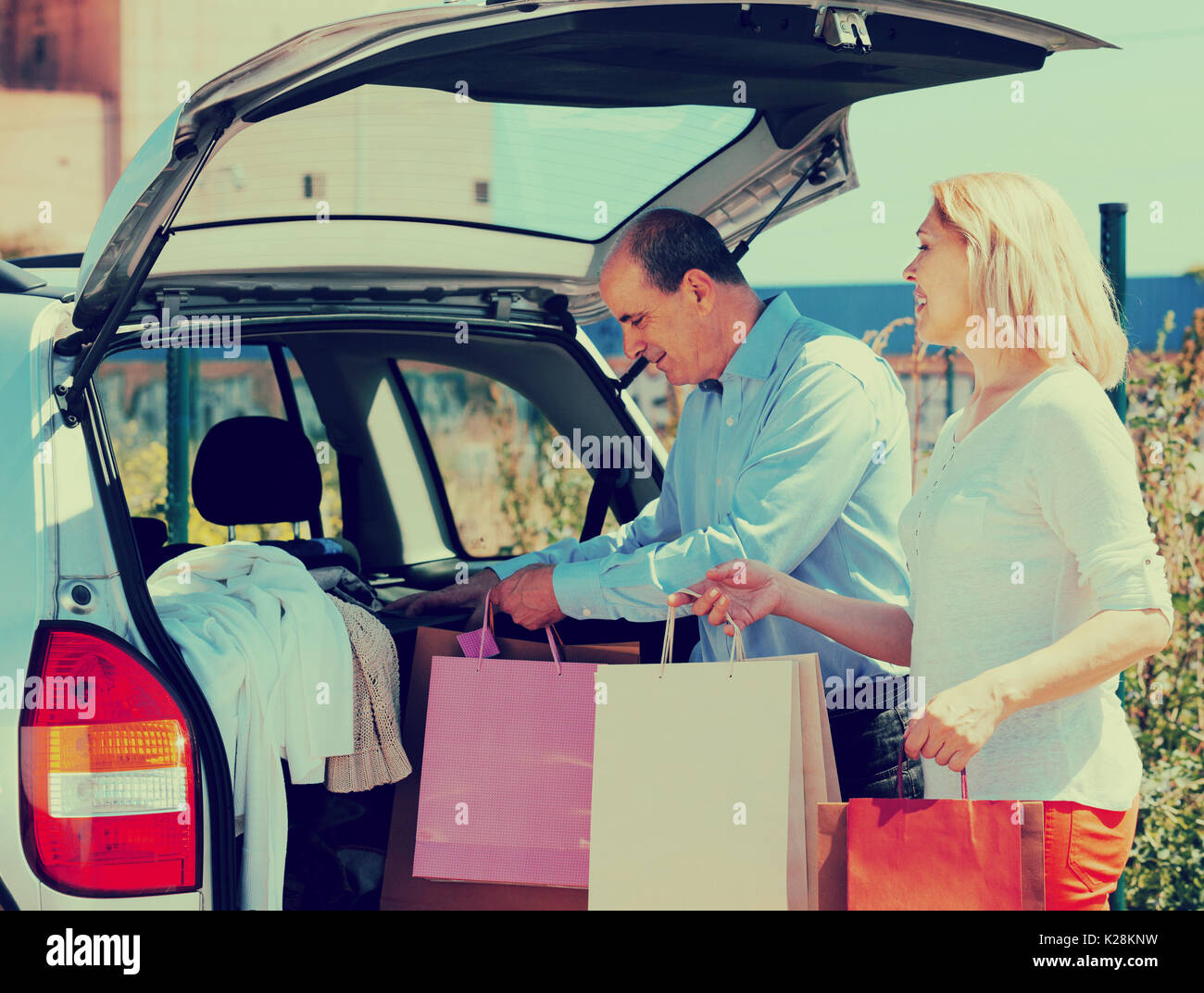 Happy excited couple packing hi-res stock photography and images - Alamy