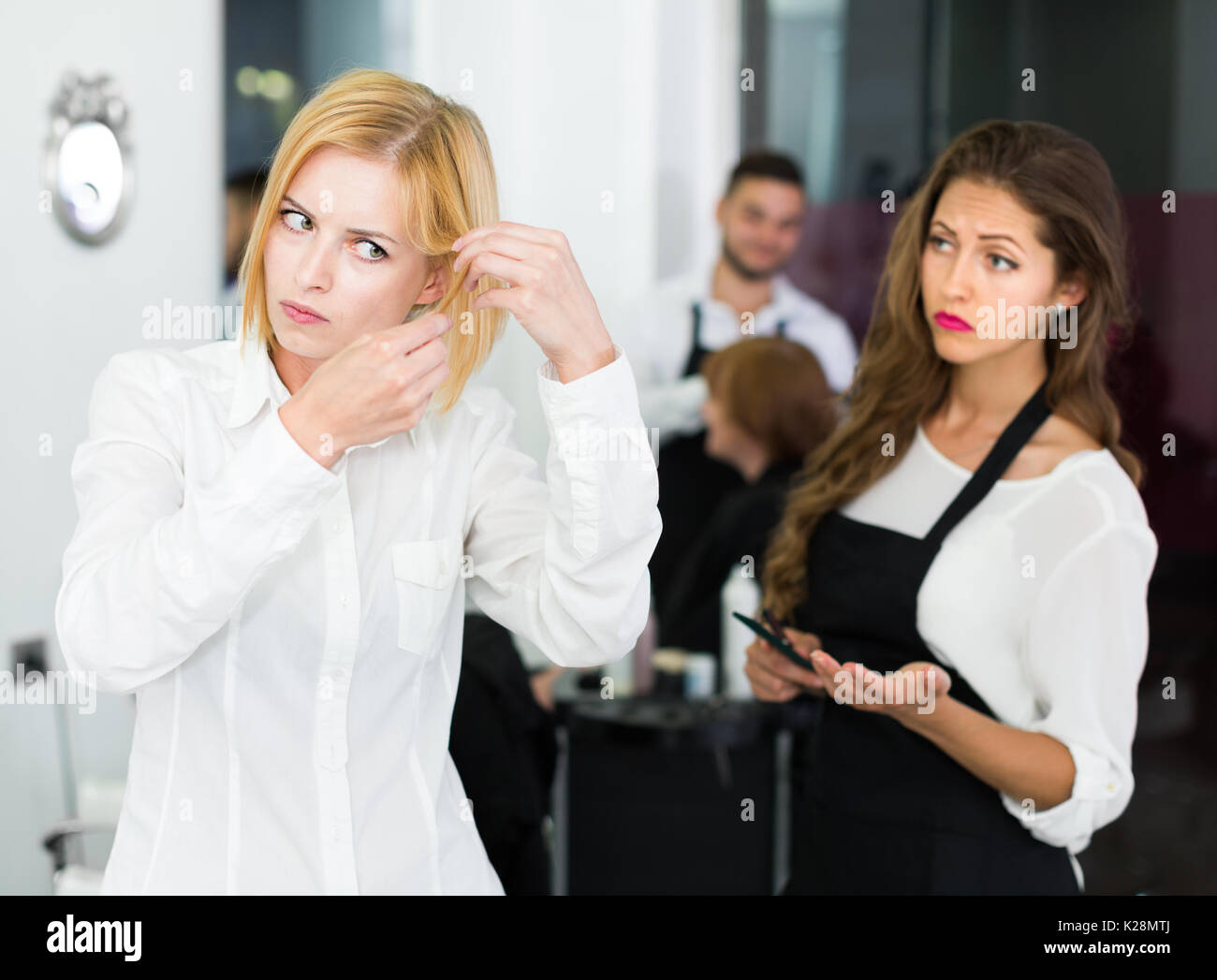 Client dissatisfied work of haircutter in the barbershop Stock Photo ...