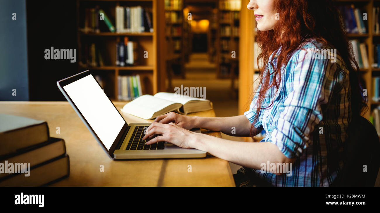 Young student studying in library Stock Photo - Alamy