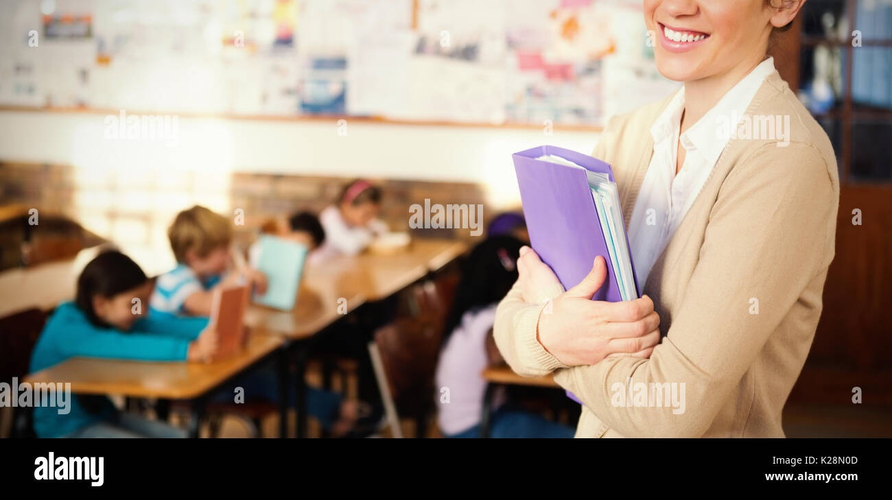 Smiling teacher pupil holding hi-res stock photography and images - Alamy