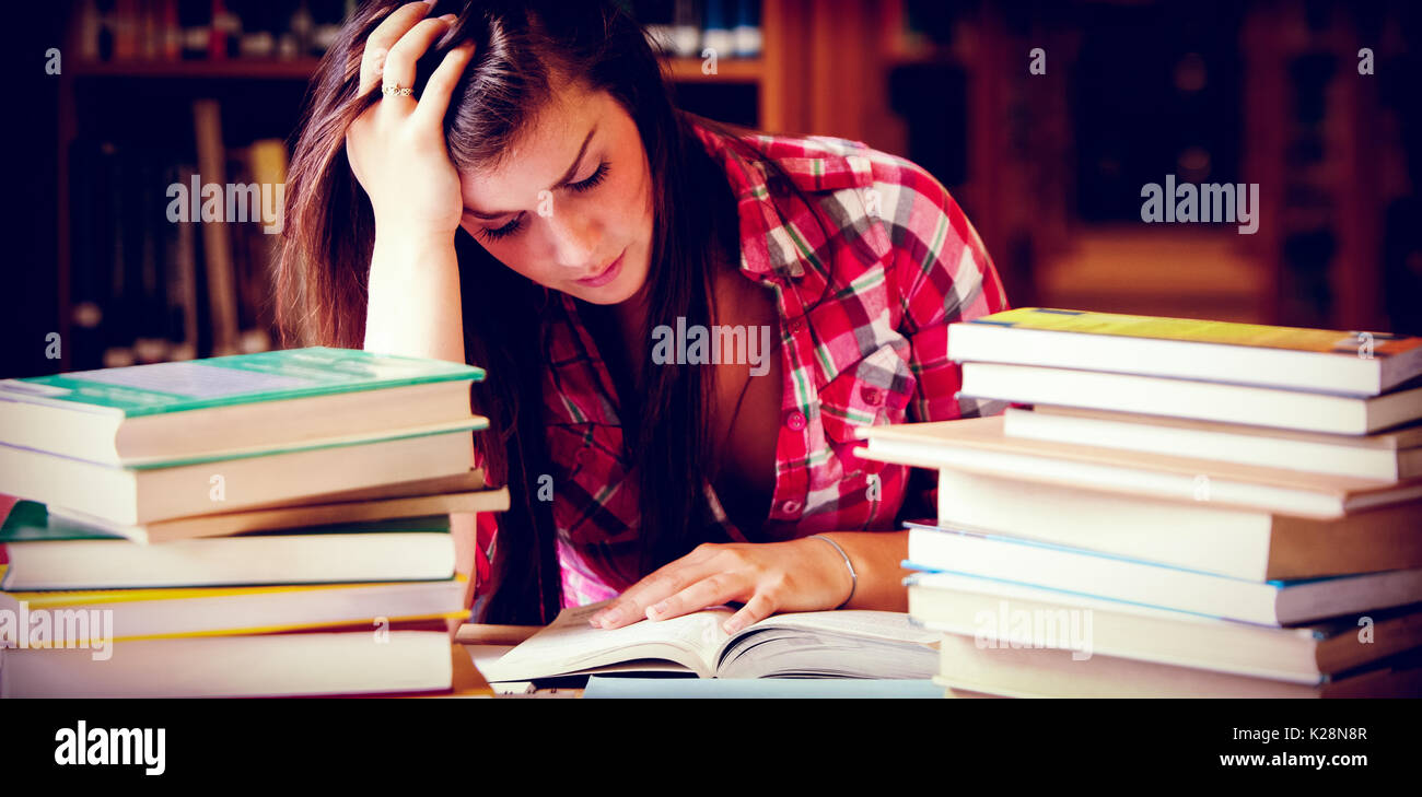Frustrated female student pile books hi-res stock photography and ...