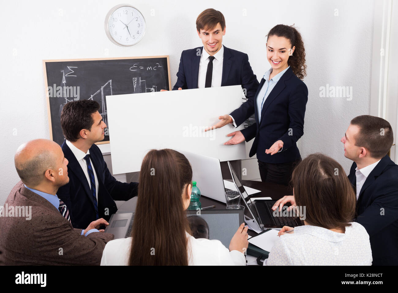 Positive people presenting new hi-res stock photography and images - Alamy