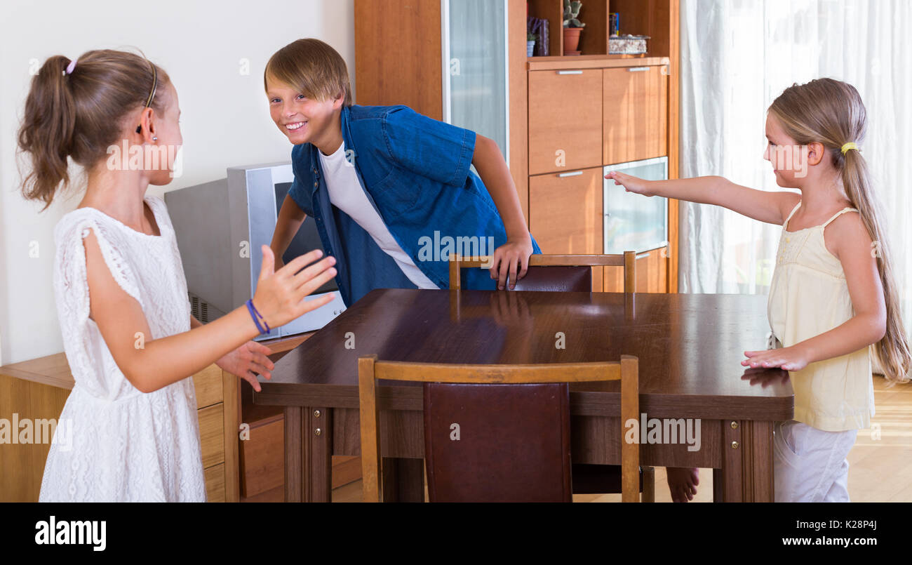 Happy friends playing romp game Touch-last at home Stock Photo - Alamy