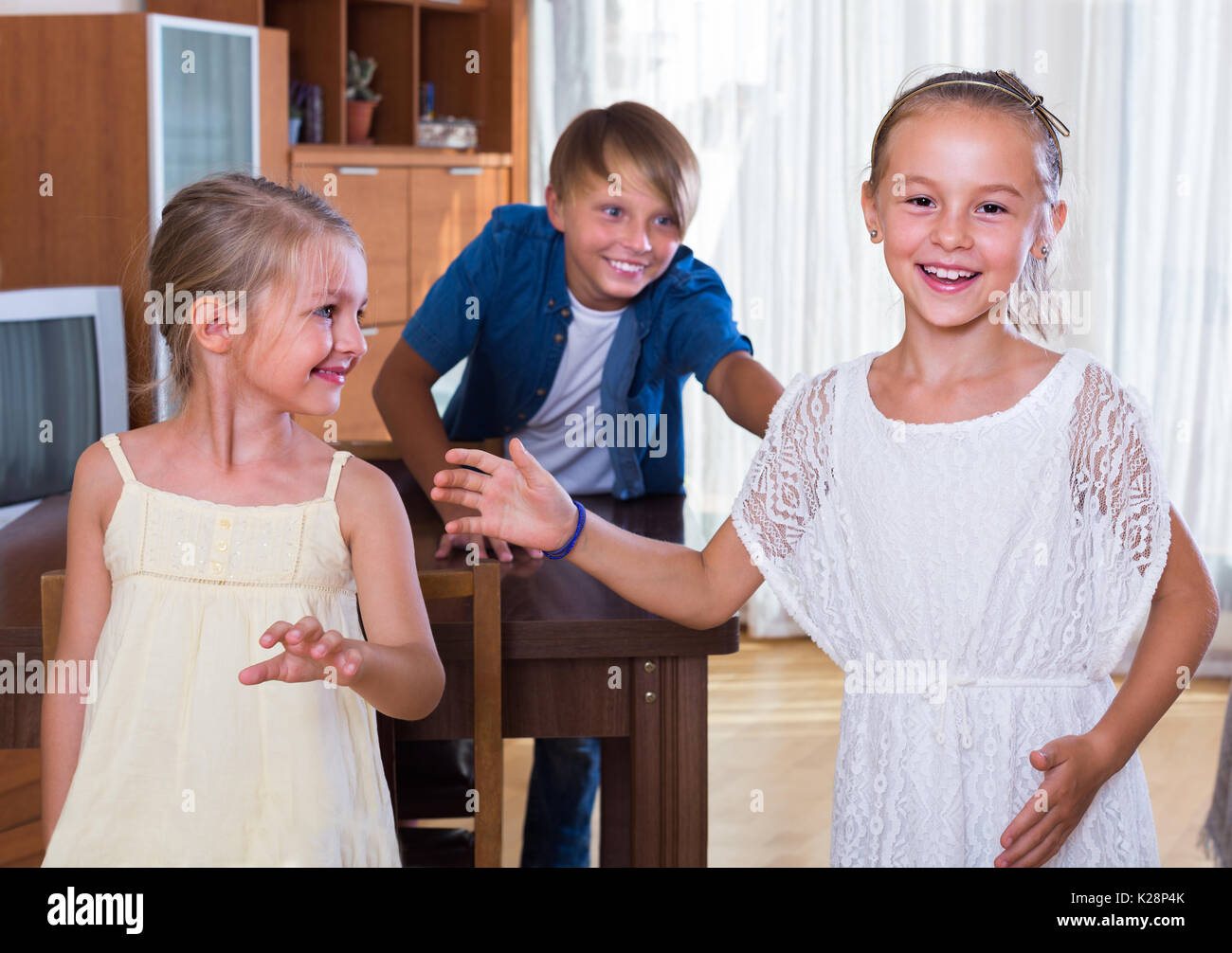 laughing children playing romp game Touch-last at home Stock Photo - Alamy