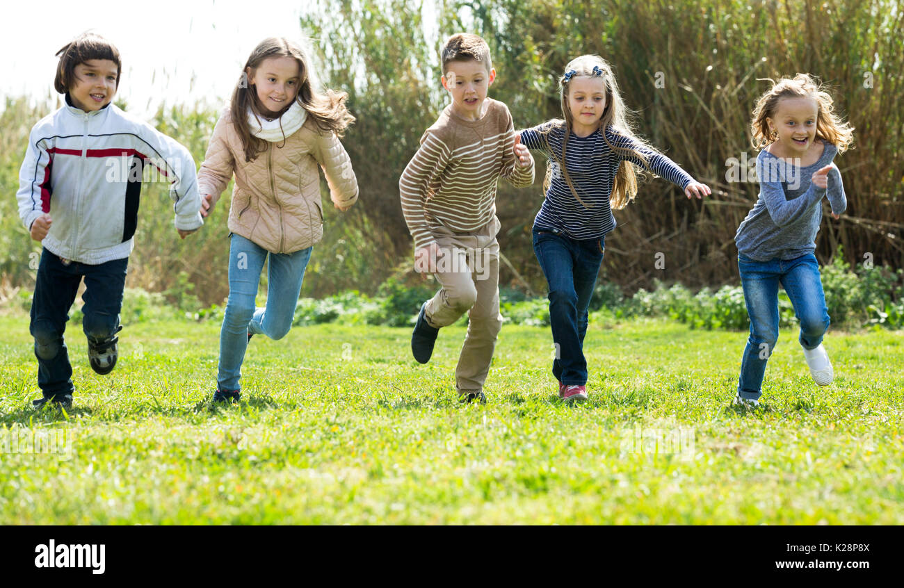 Boys running through the field hi-res stock photography and images - Alamy