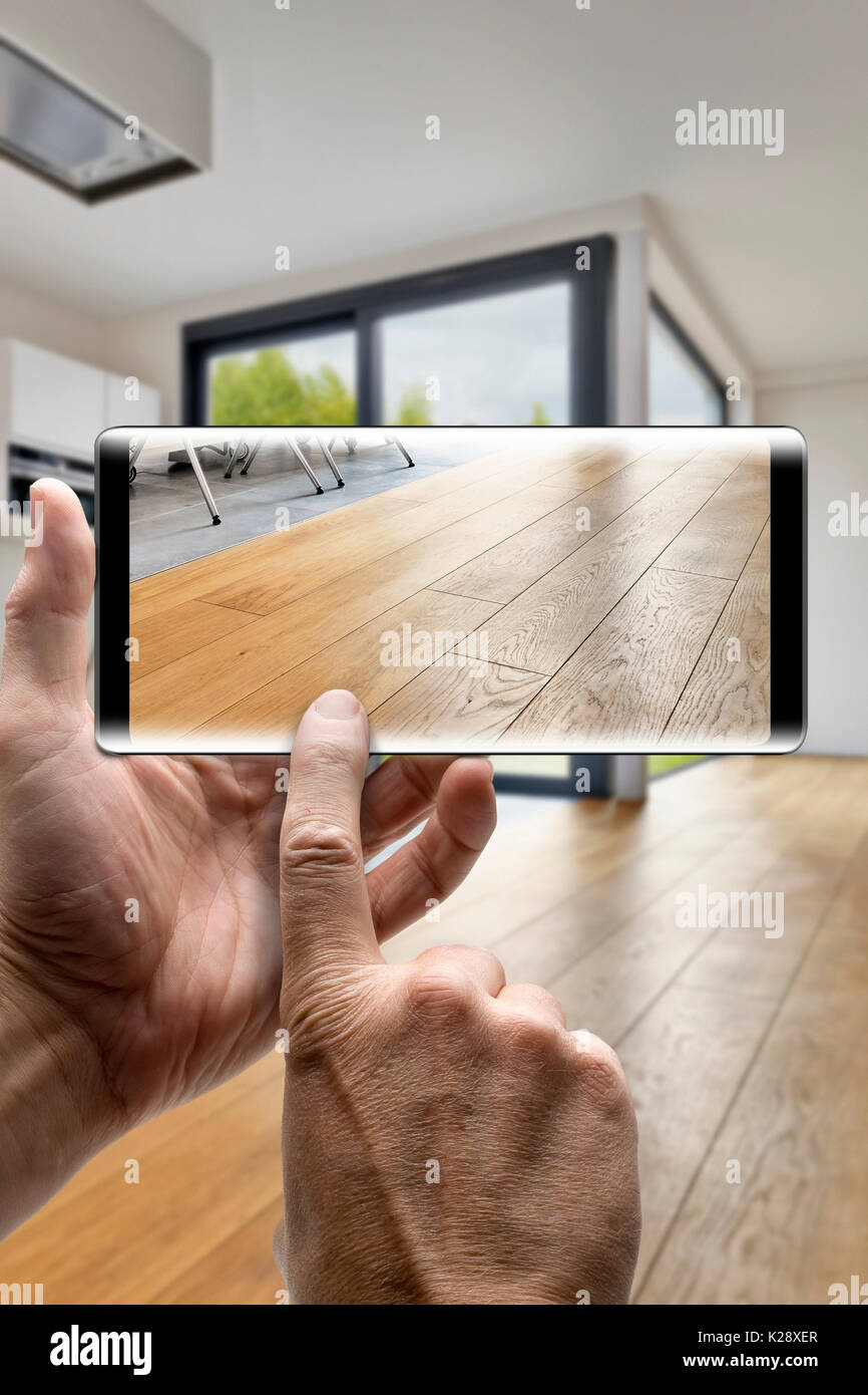 Two hands holding a mobile Smartphone and take a picture in a Modern ...