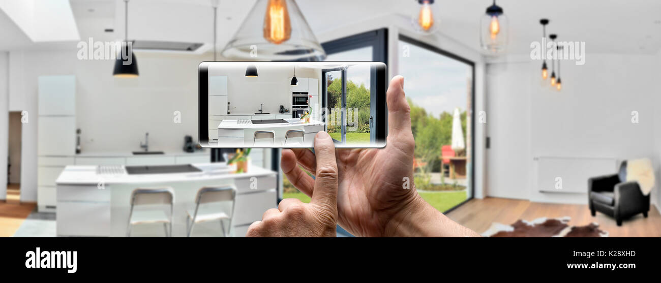 Two hands holding a mobile Smartphone and take a picture in a Modern ...