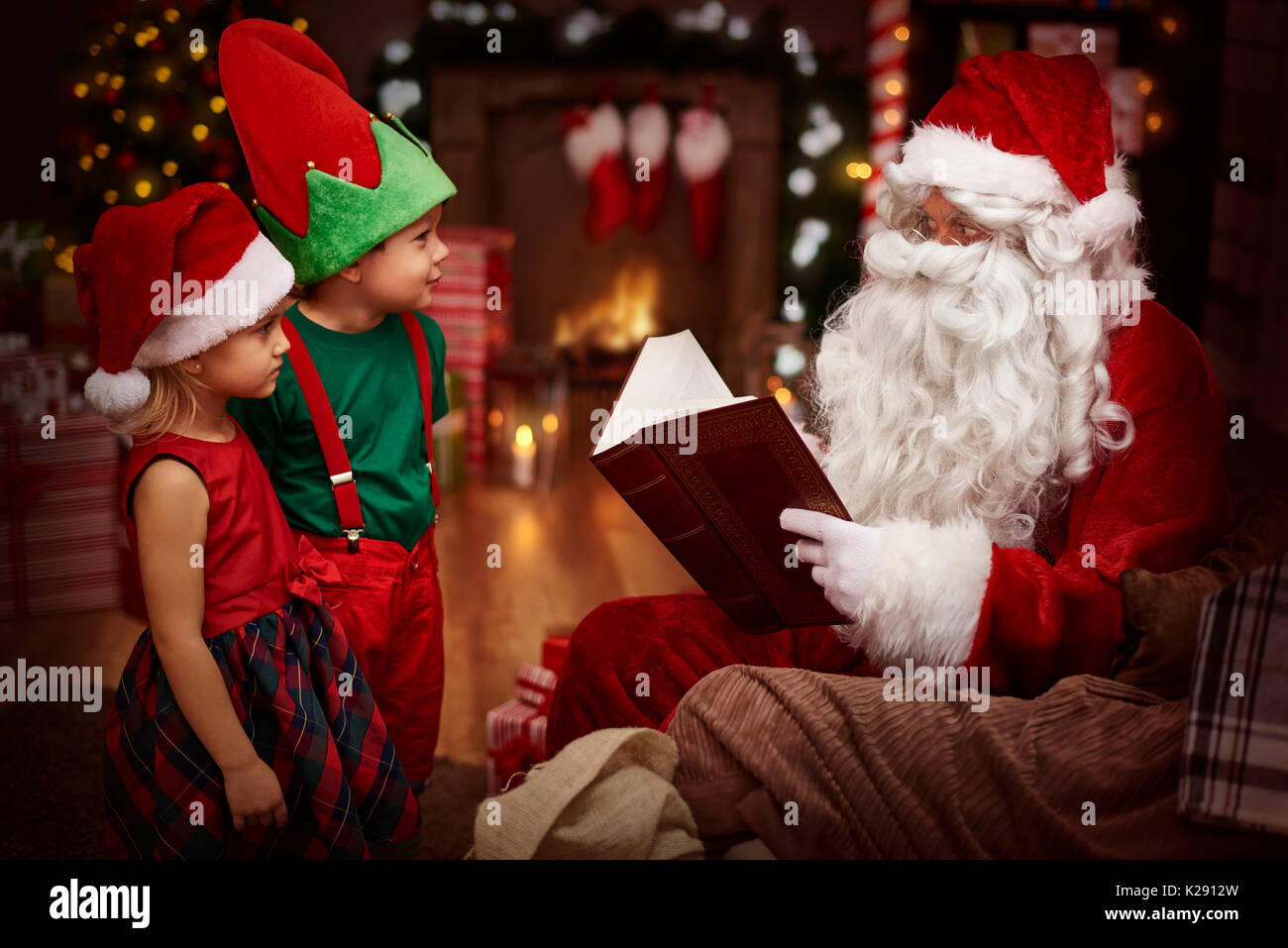 Santa Reading A Book To Children