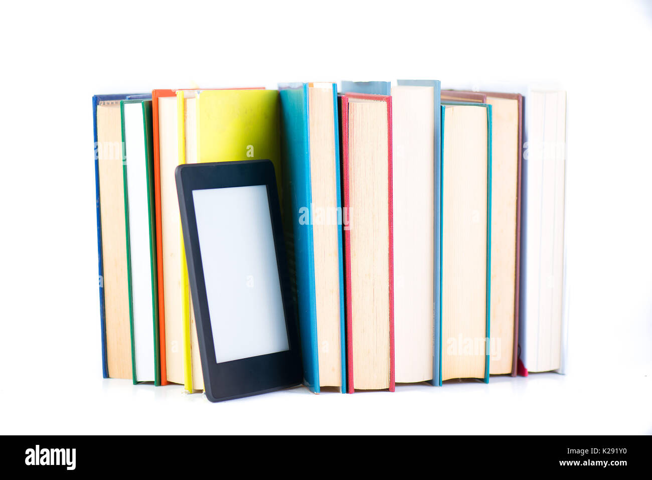 Ebook among paper books. new technology concept with white background ...
