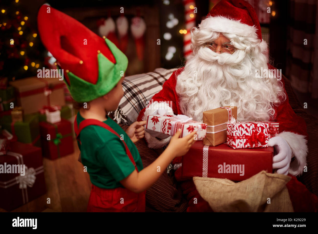 Little helper of St. claus at the work Stock Photo - Alamy