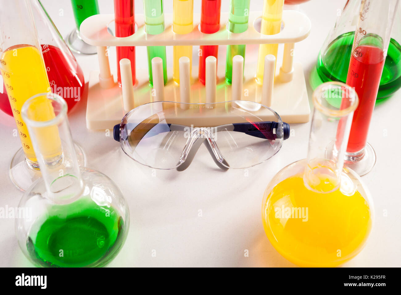 Different Chemistry lab set on a table over blue background Stock Photo ...