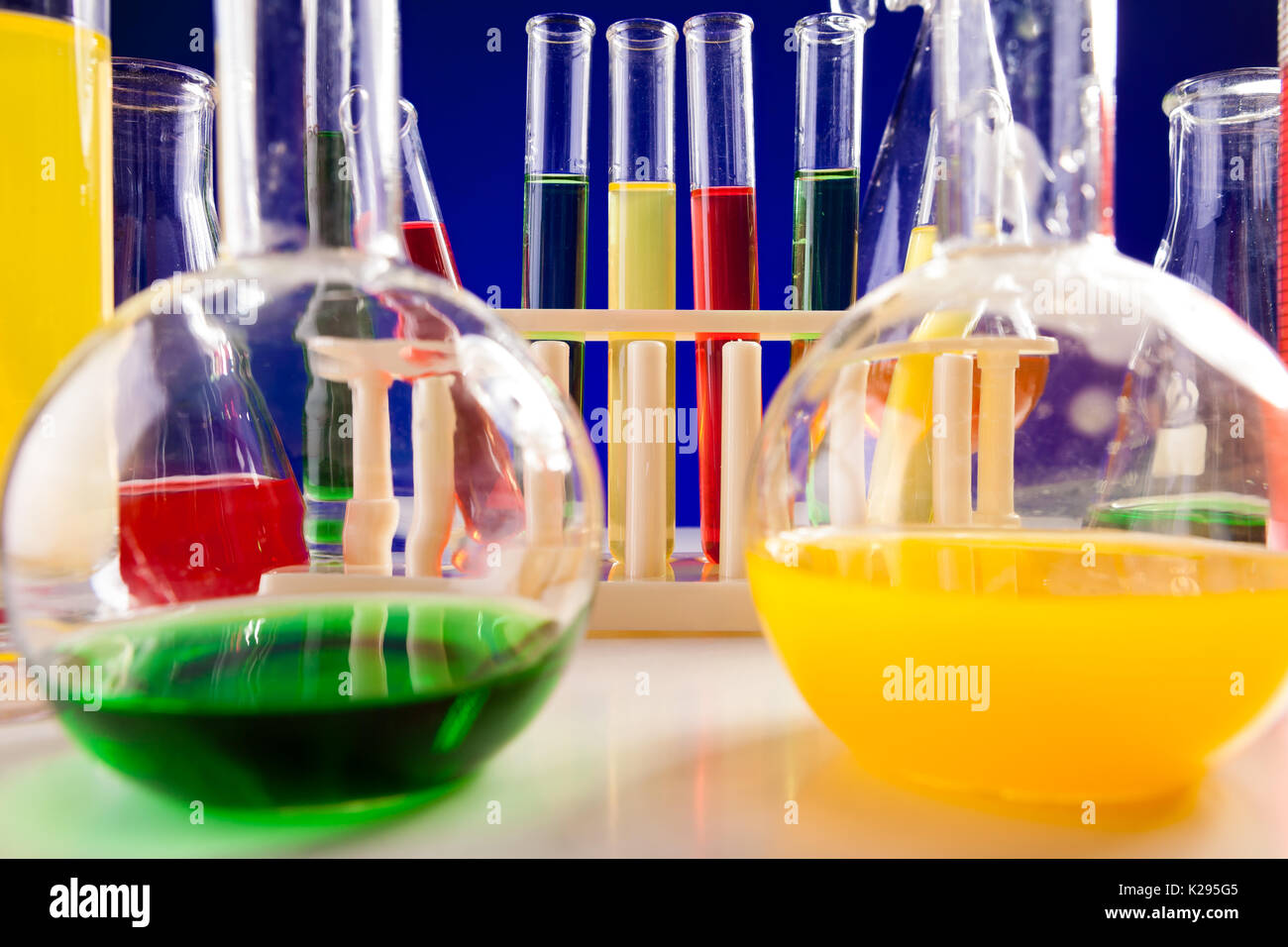 Chemistry equipment set on a table over blue background Stock Photo - Alamy