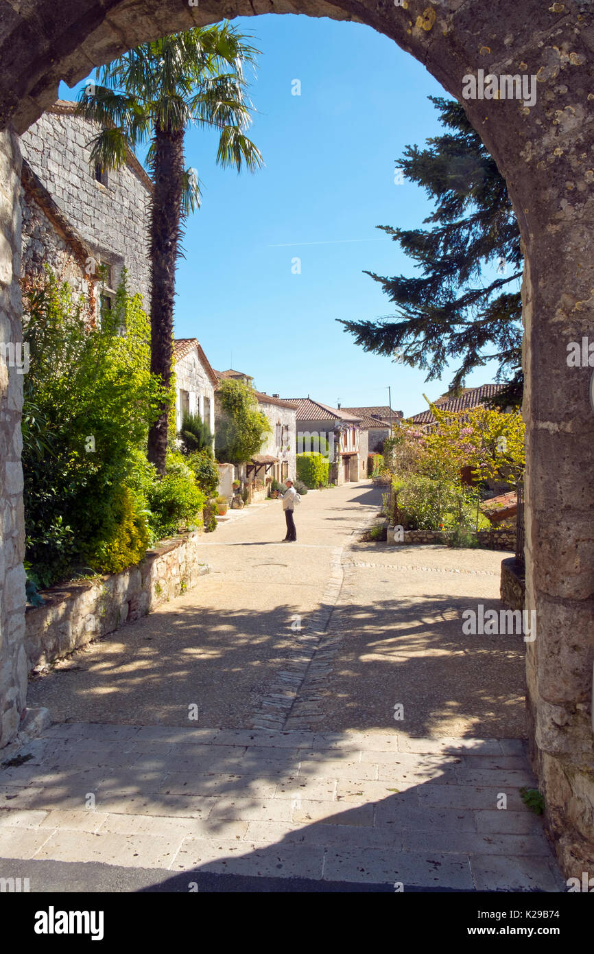 Street view through the arch of Porte des Anglais, Pujols, Lot-et ...
