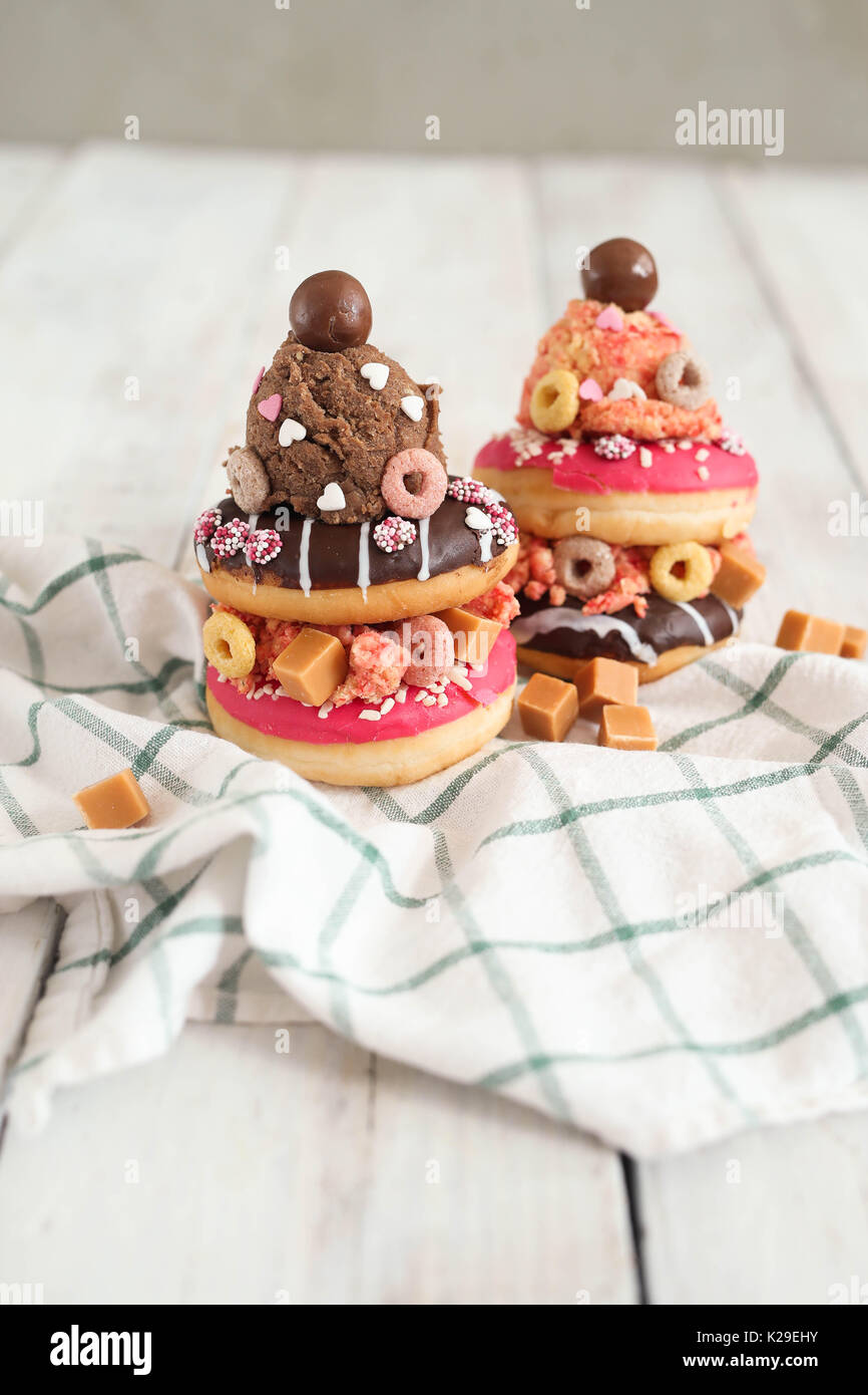 Sweet donut with ice cream on top Stock Photo - Alamy