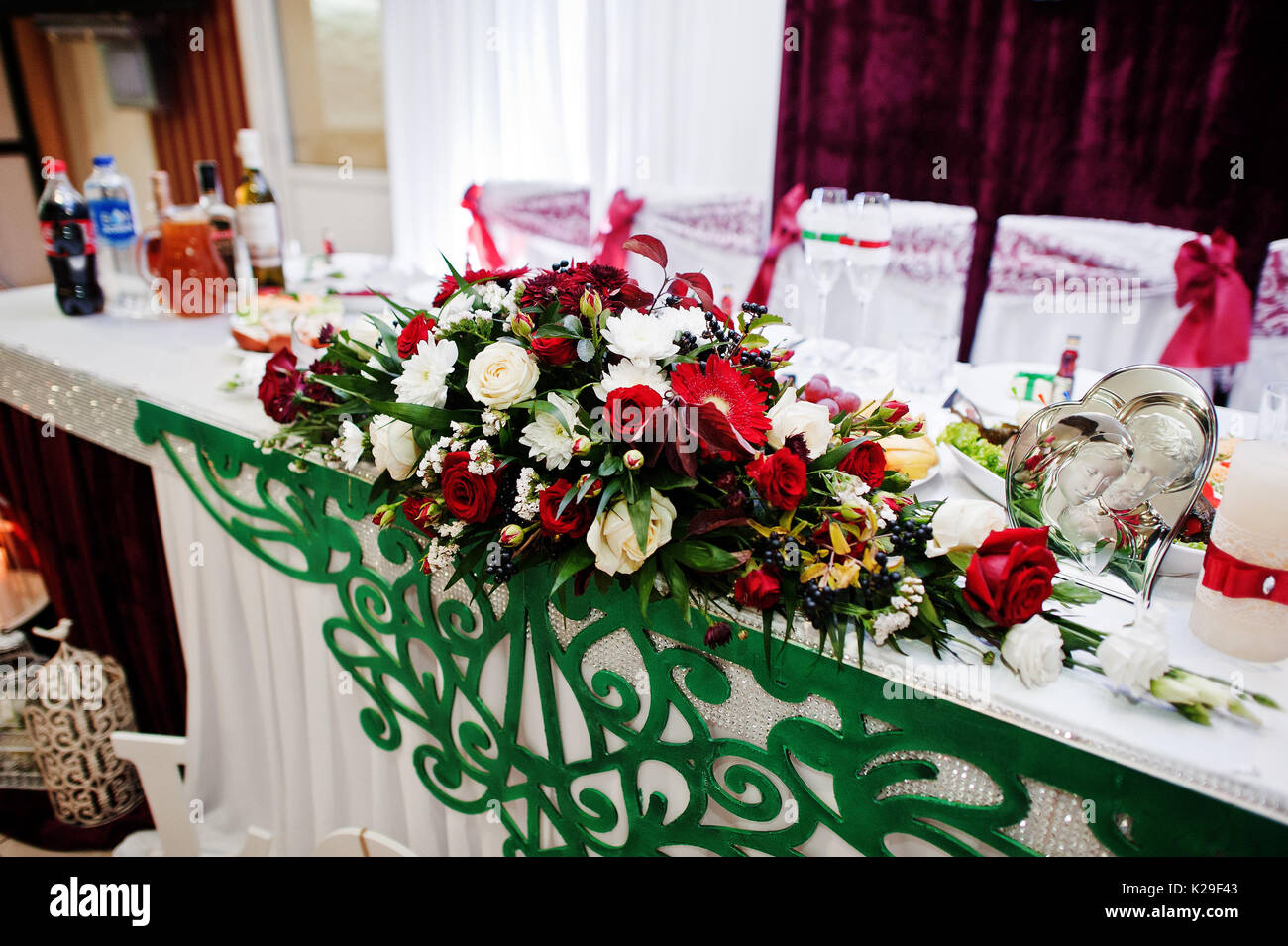 Good-looking wedding tables decorated with flowers and nicely catered ...