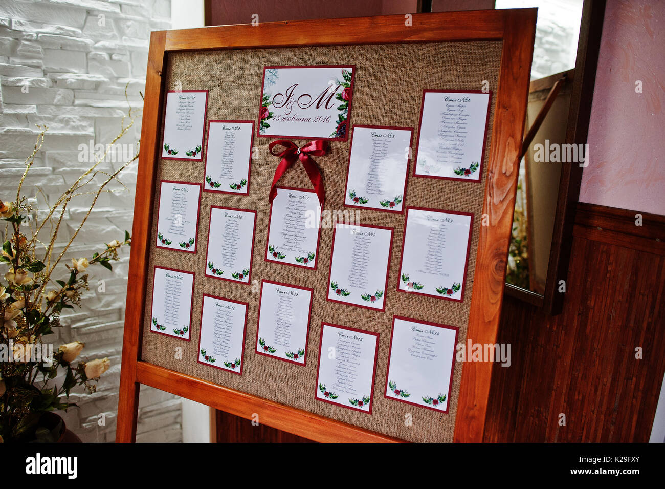 Wedding wooden board with guest list and table numbers on it Stock ...