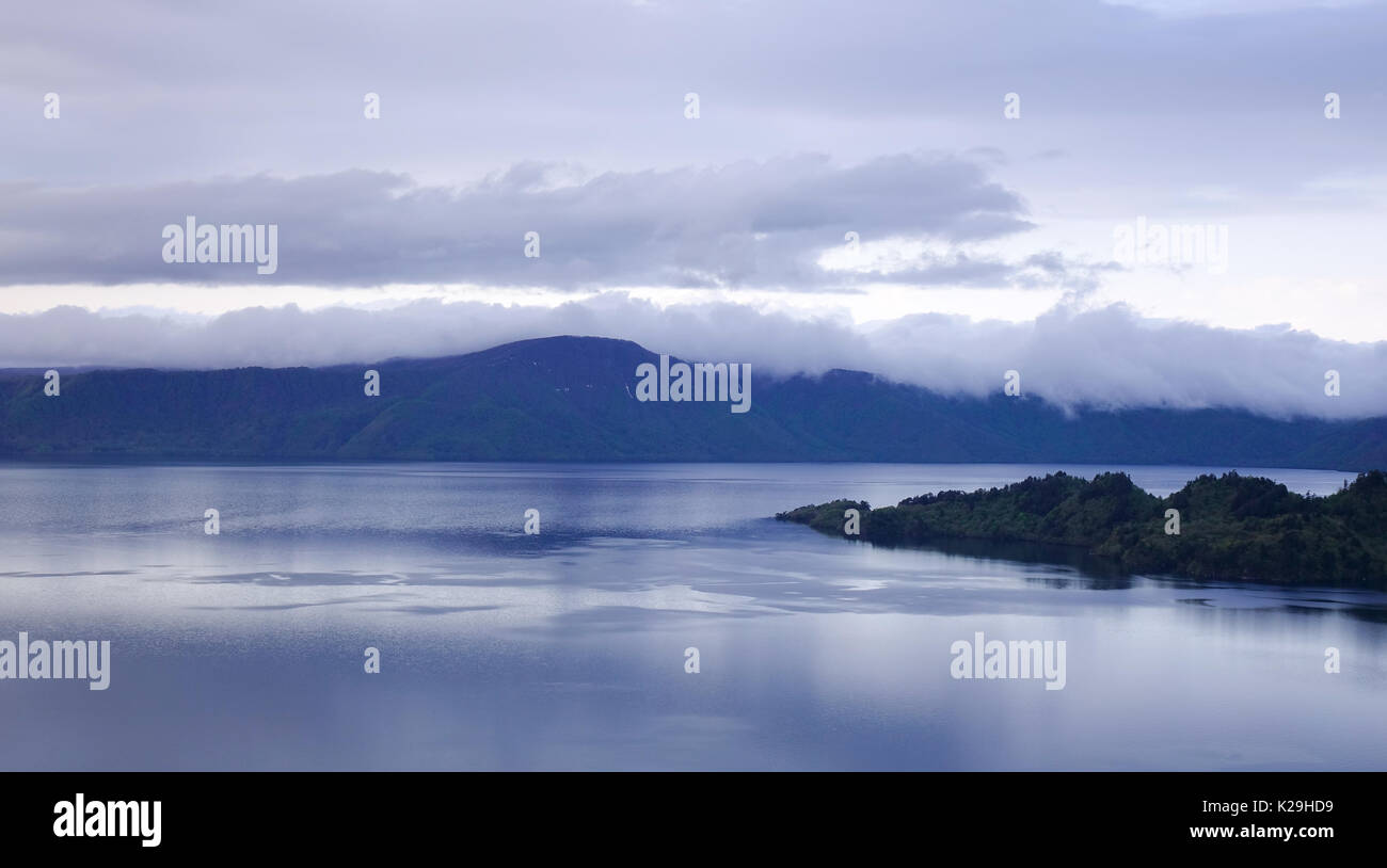 Lake Towada with mountains at sunset in Aomori, Japan. Lake Towada is ...