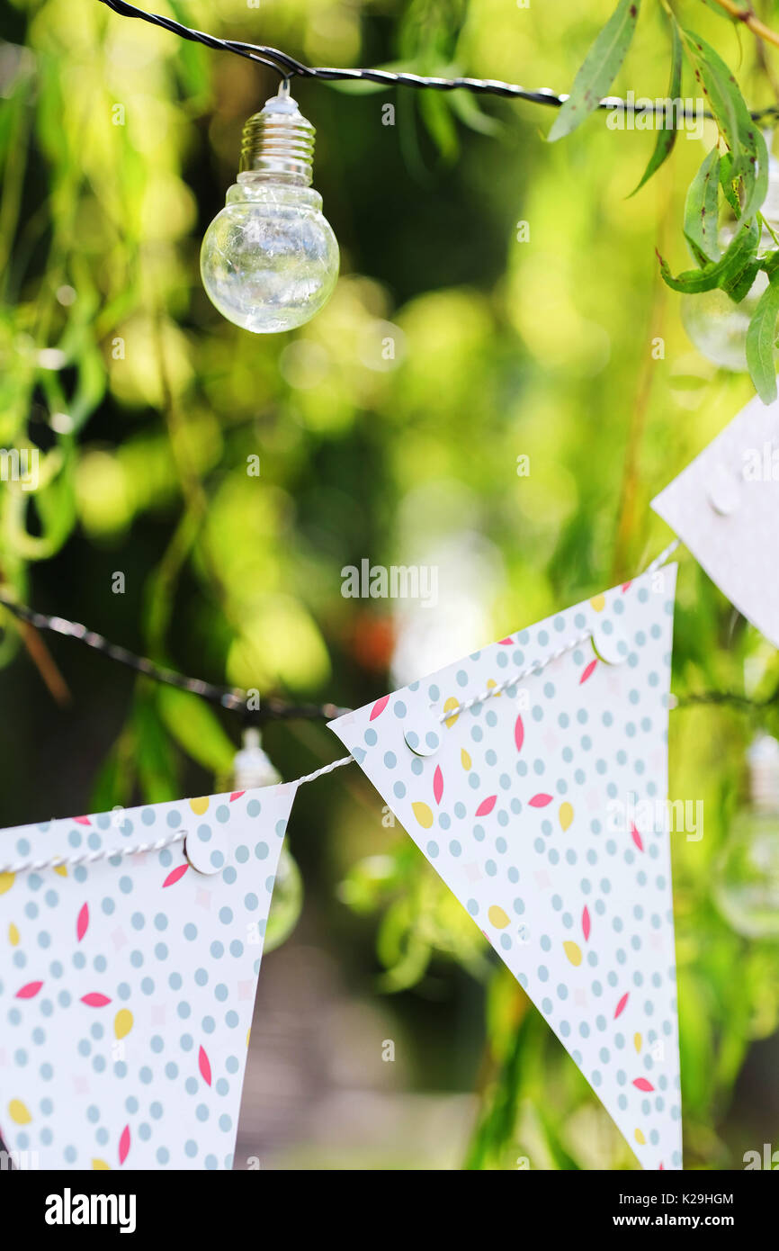 Outdoor. Light bulbs on a wire Stock Photo - Alamy