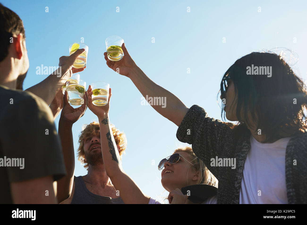 Toasting with Mojito Cocktails Stock Photo - Alamy