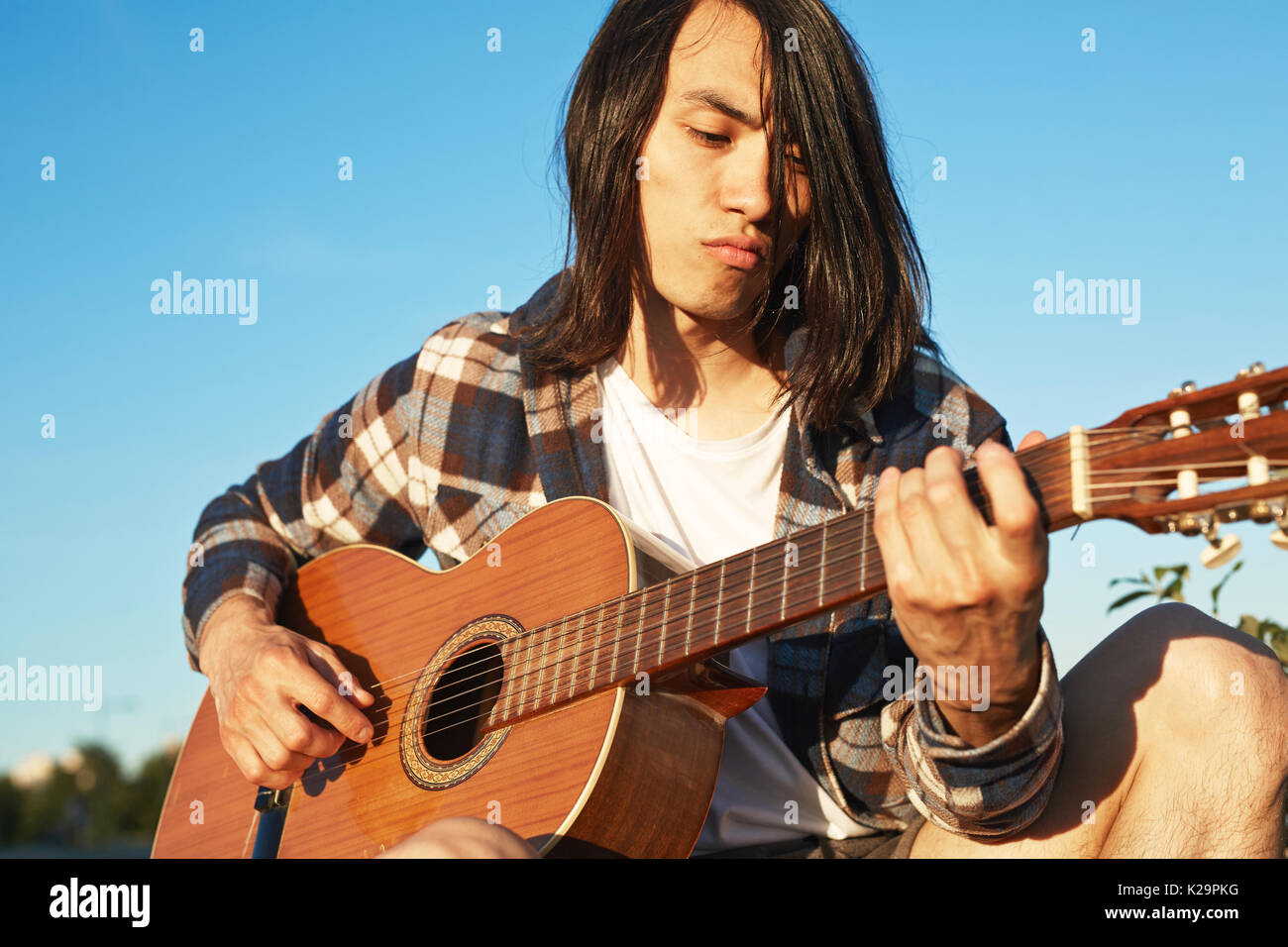 Asian guitar player hi-res stock photography and images - Alamy