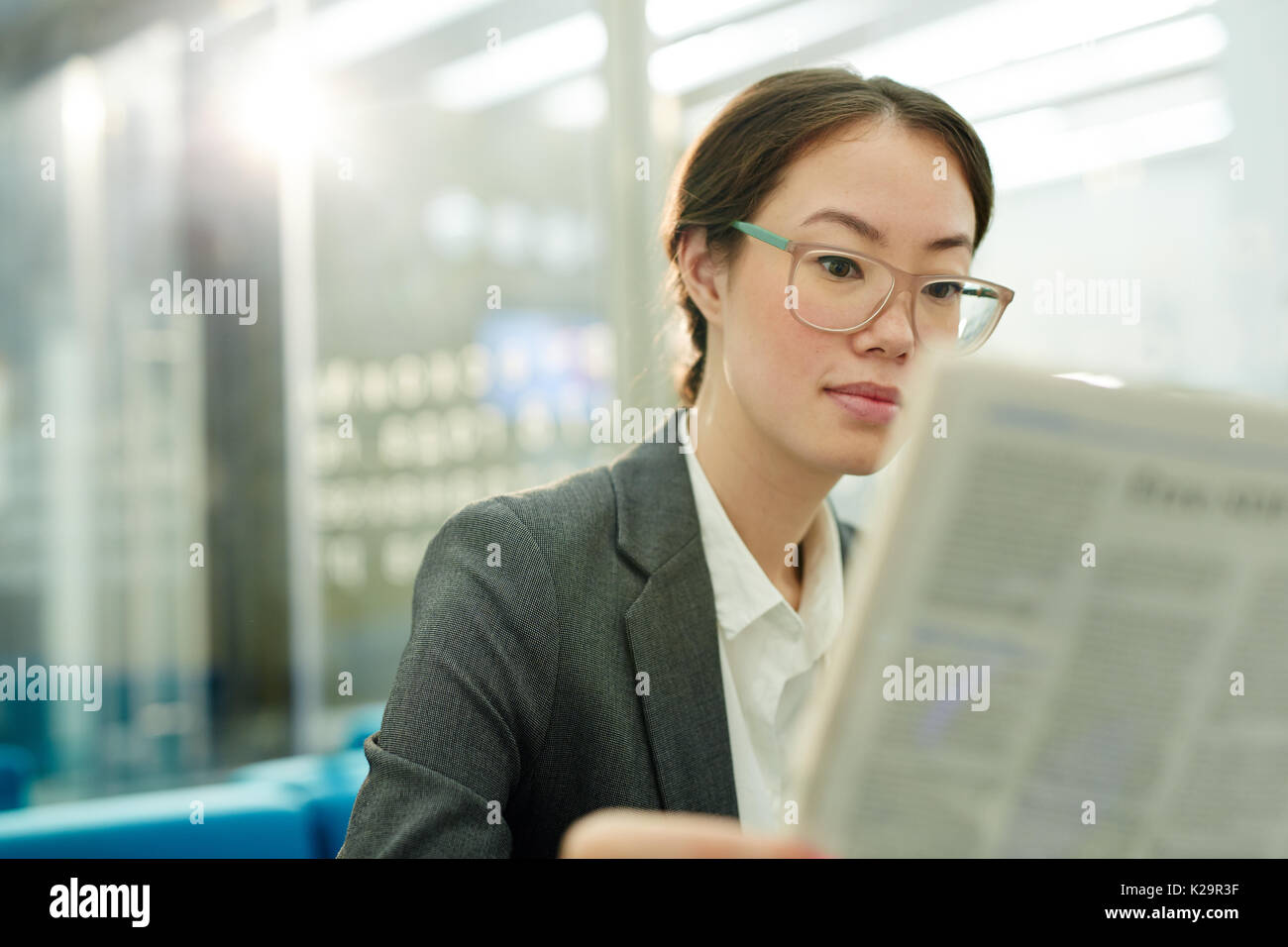 Reading financial news Stock Photo - Alamy