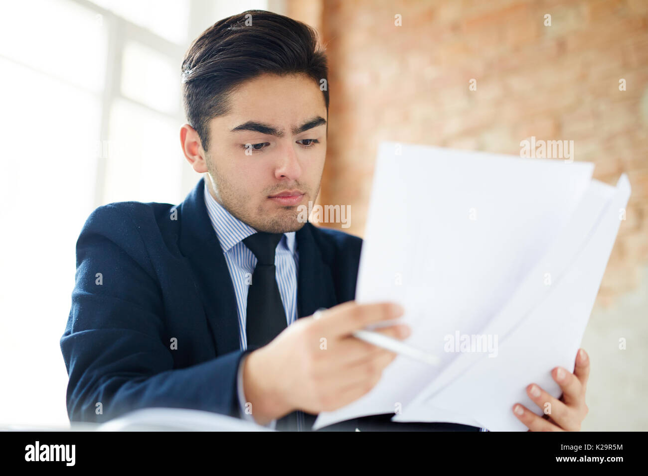 Working with papers Stock Photo - Alamy