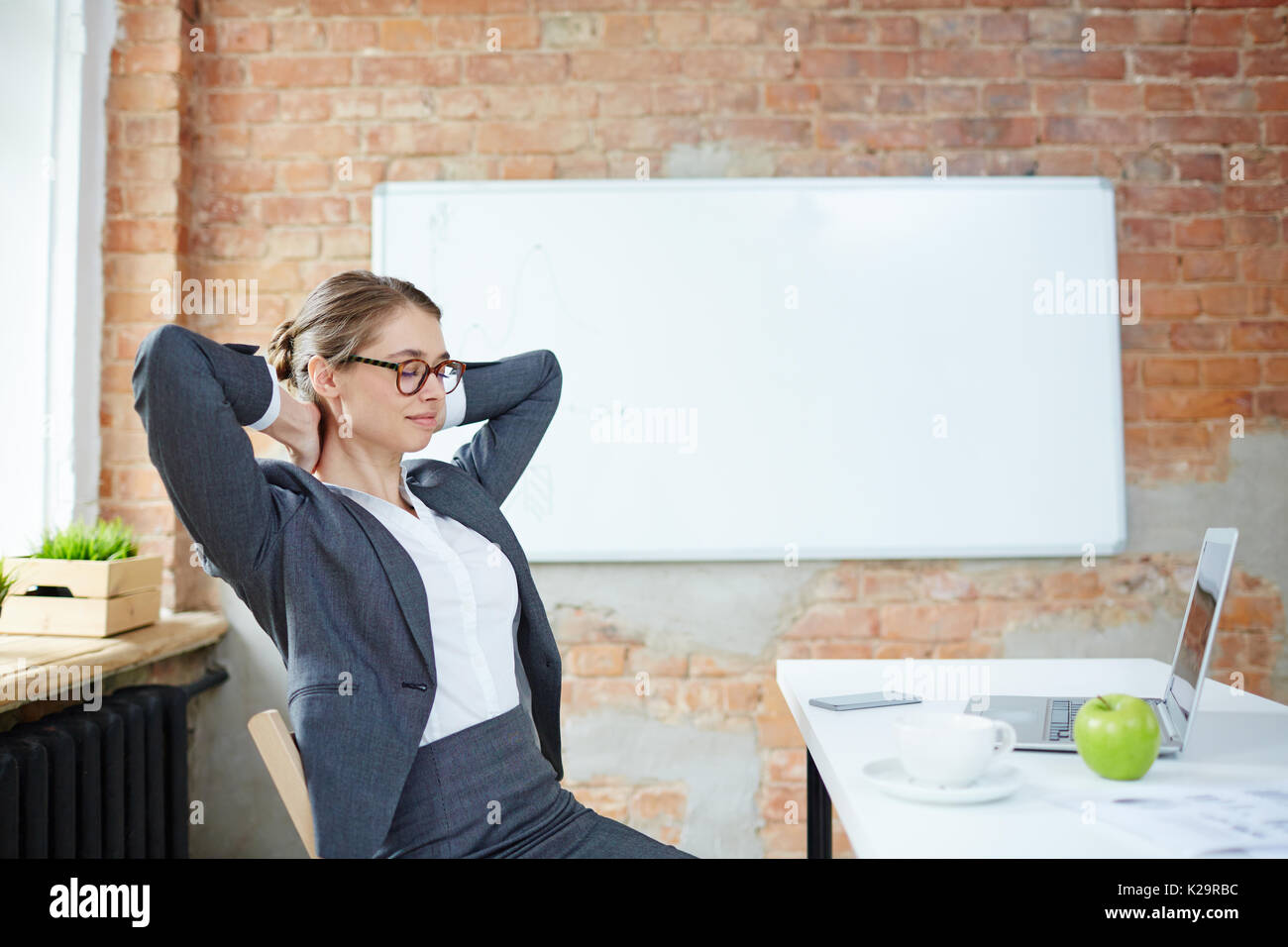 Relaxing by workplace Stock Photo - Alamy
