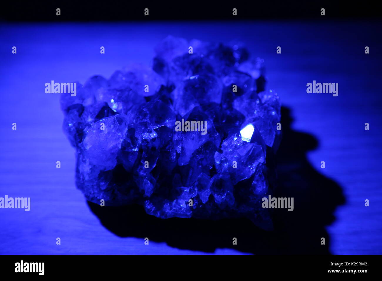 Amethyst under UV light Stock Photo - Alamy