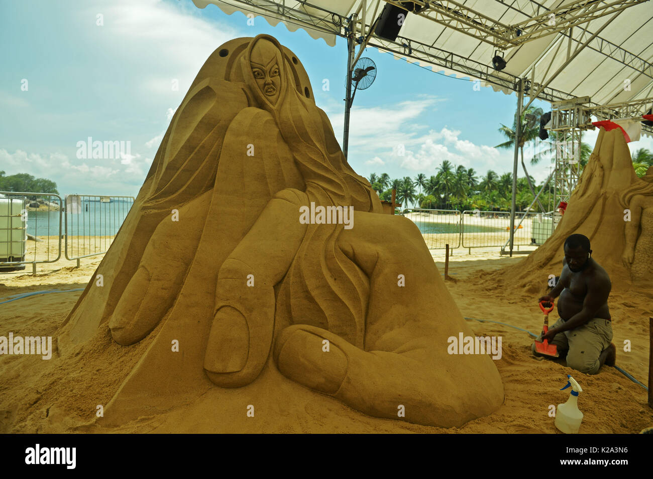Singapore. 30th Aug, 2017. Sand sculpture master works on creations at ...