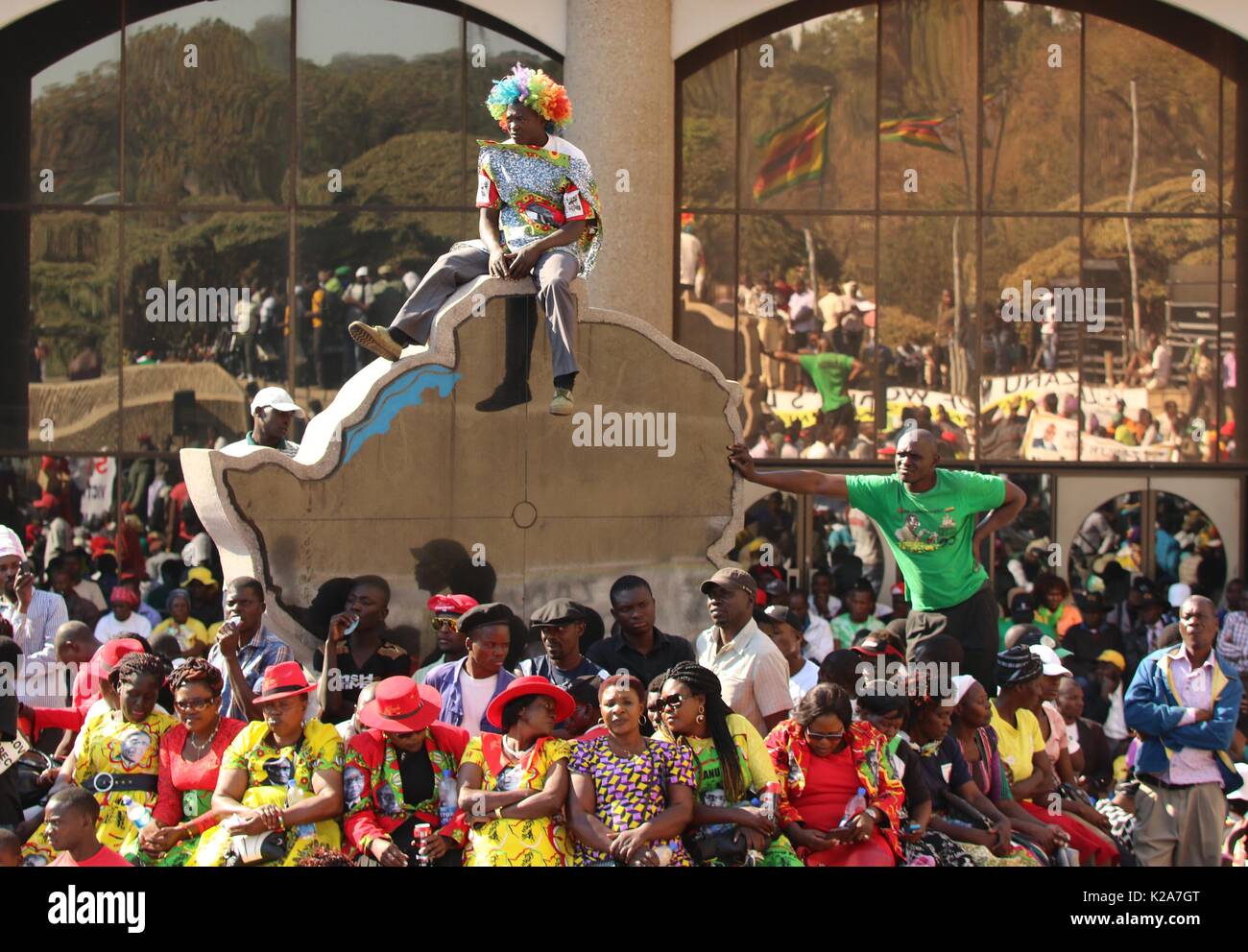 Harare. 30th Aug, 2017. People take part in a rally to support the ...