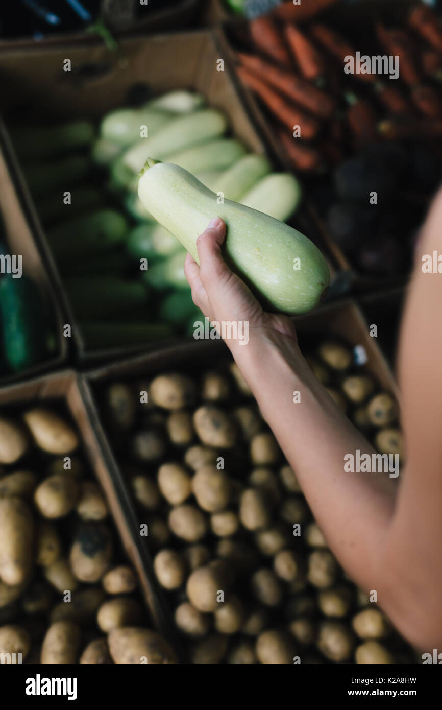 Crop person buying vegetables Stock Photo - Alamy