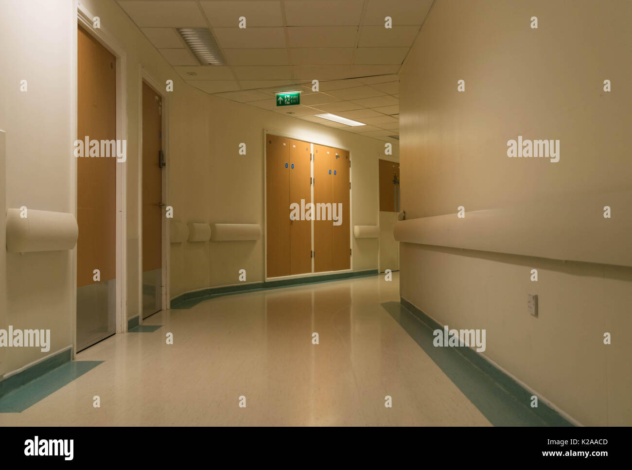 Curved hospital corridor at night Stock Photo - Alamy