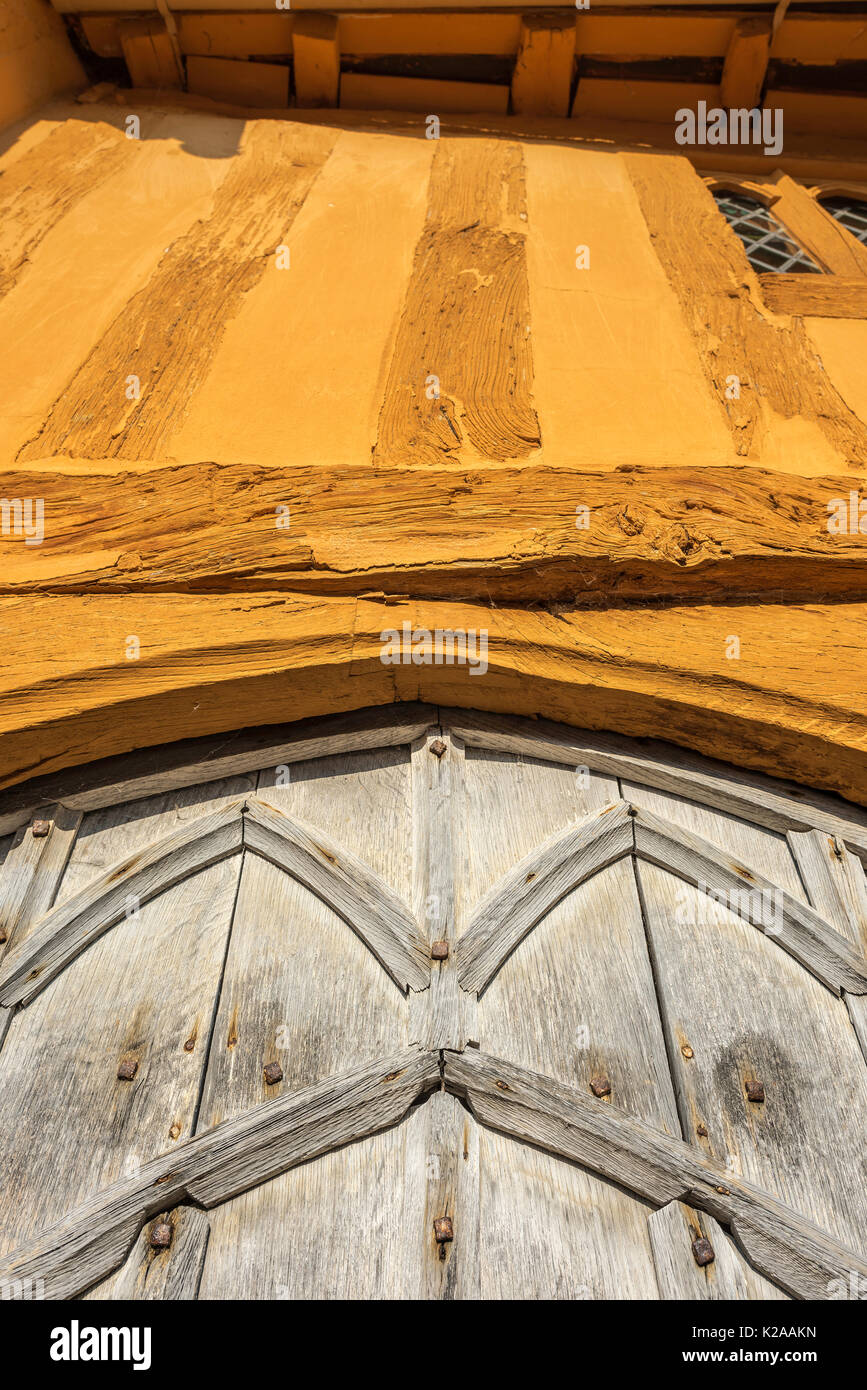Medieval oak building, detail of the gothic oak door and timbers of ...