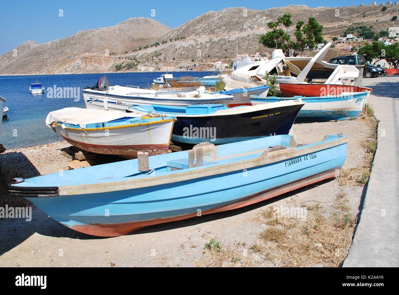 Small boats on the beach at the Harani boatyard at Yialos harbour on ...