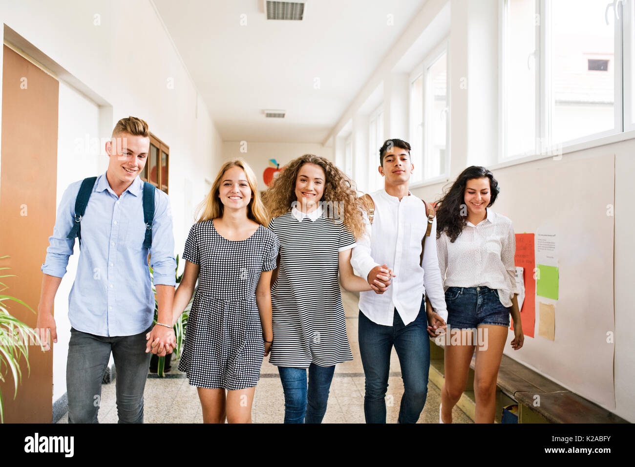 Teen students walking to school hi-res stock photography and images - Alamy