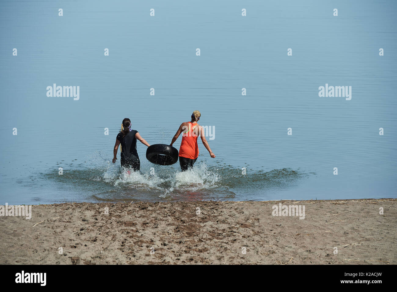Group training beach hi-res stock photography and images - Alamy
