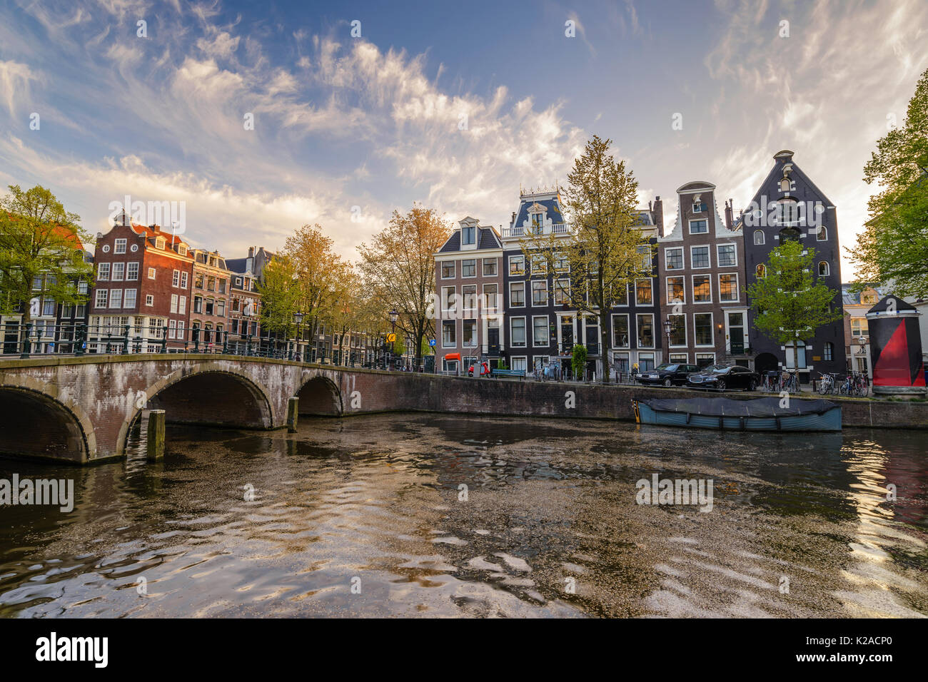 Amsterdam city skyline at canal waterfront, Amsterdam, Netherlands ...
