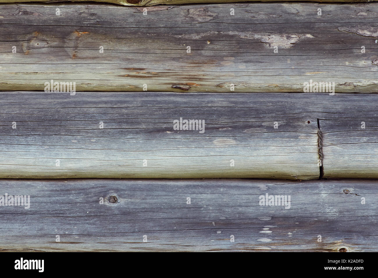 Wooden texture of several gray logs lying on top of each other Stock ...