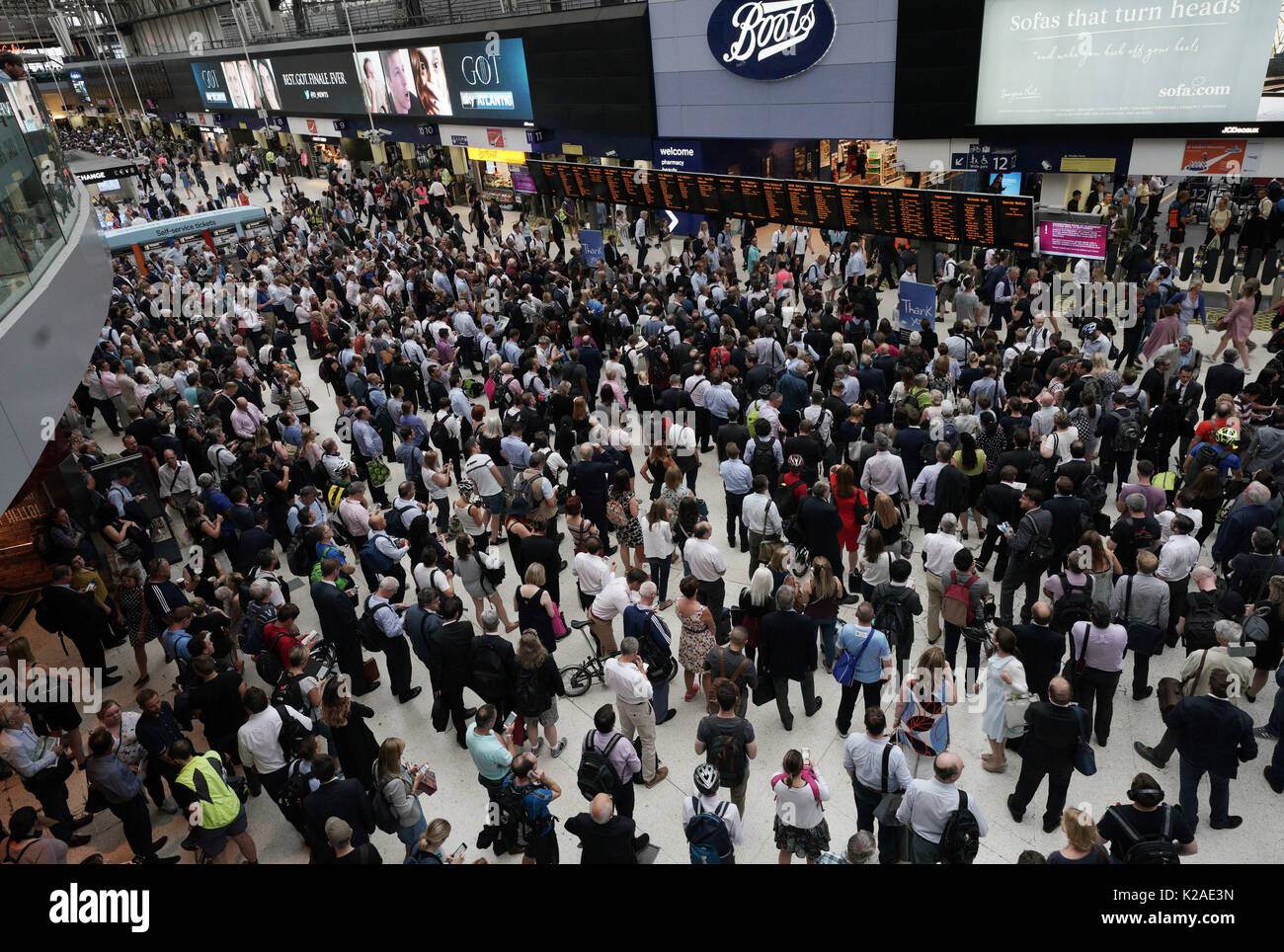 Commuters at Waterloo Station, London, during the evening rush hour, as ...