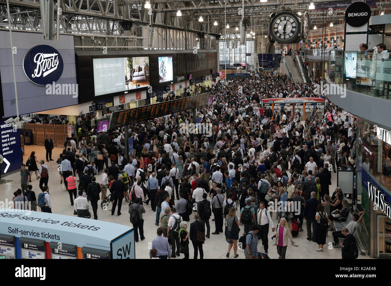 Commuters at Waterloo Station, London, during the evening rush hour, as ...