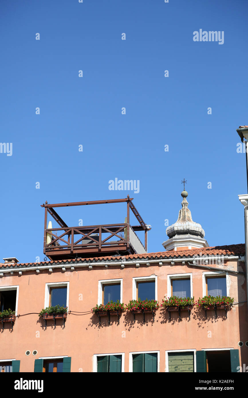 Roof top outdoor balcony built on the roof of an old apartment block ...