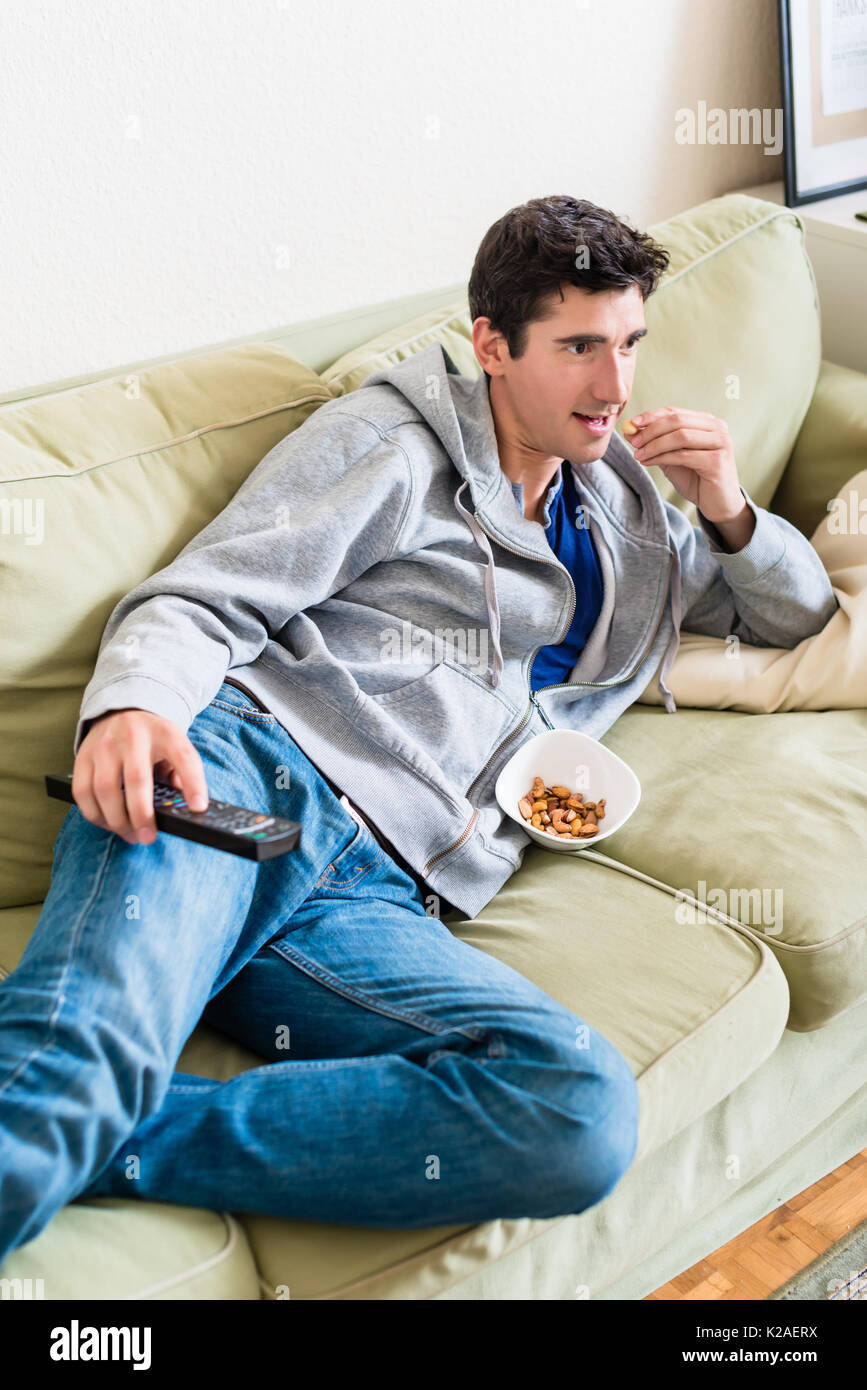 Funny young couple playing together a video game on console at h Stock ...