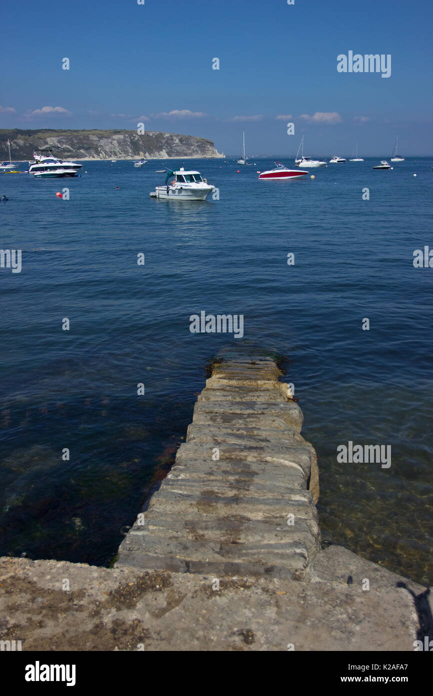 Stone Jetty leading into water Swanage Dorset Stock Photo - Alamy