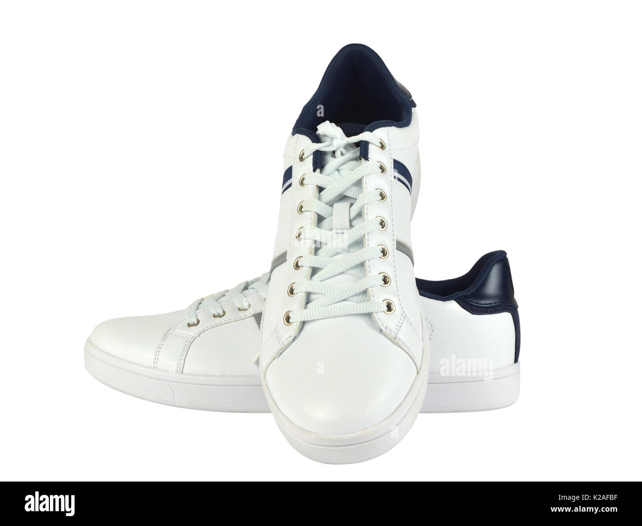 Two white sneakers, one behind the other, isolated on white background ...