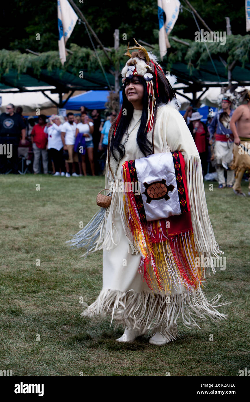 A woman wearing traditional northeastern Native American Regalia ...
