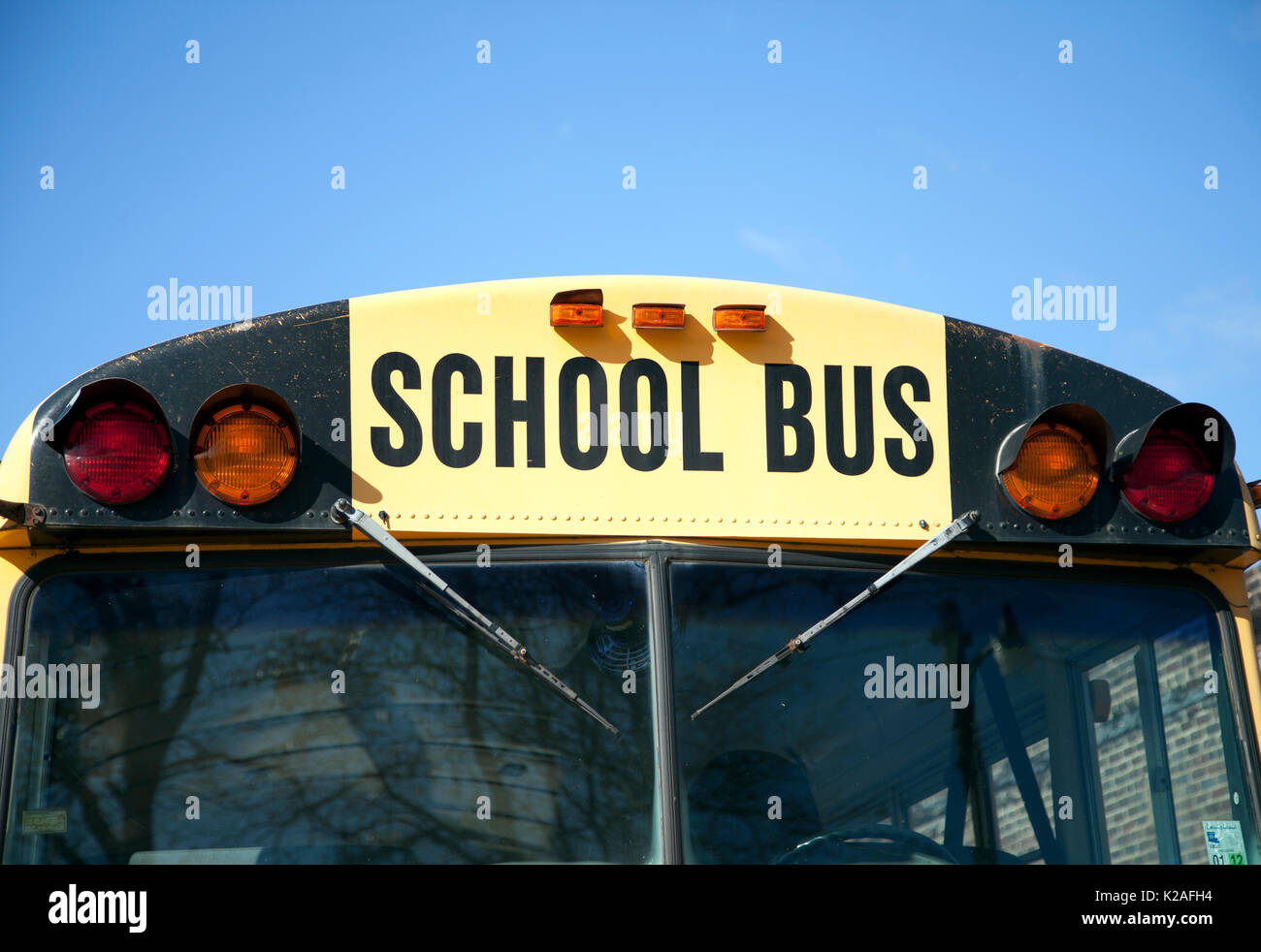 Close up of the front of a yellow school bus Stock Photo - Alamy