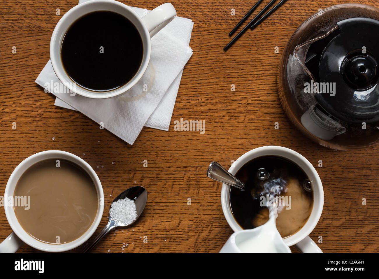 Coffee with friends around a table Stock Photo - Alamy