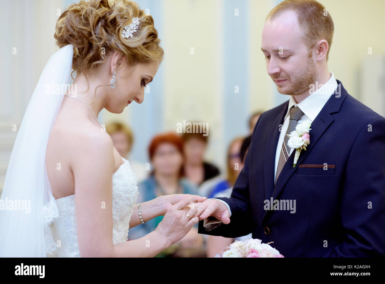 Beauty bride and handsome groom are wearing rings each other Stock ...